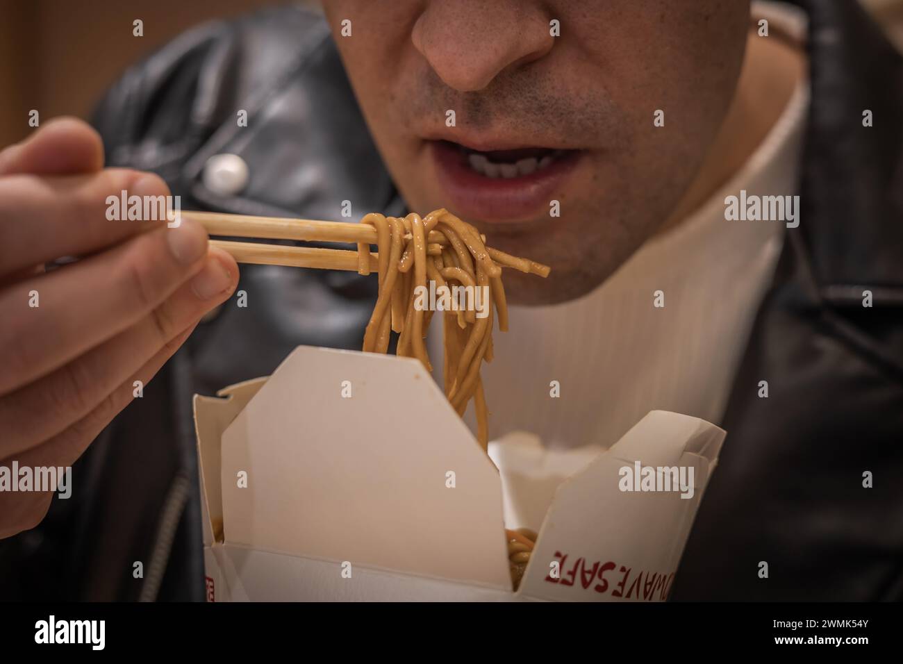 Asian man eating closeup hi-res stock photography and images - Alamy