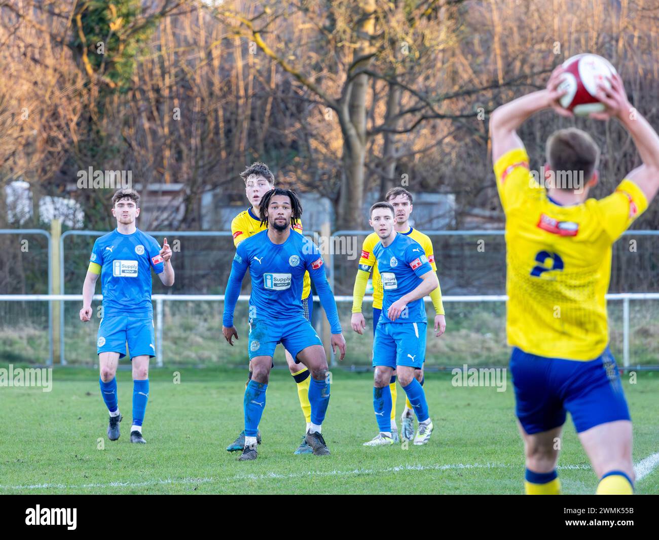 A Matlock football player takes a throw-in at The Hive Arena, Gorsey Lane, home of Warrington ...