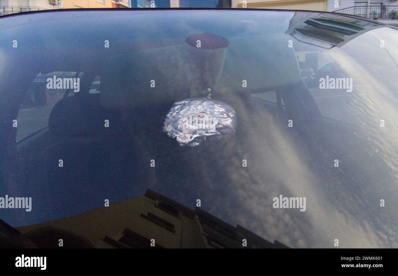 Bulls eye crack in the middle of windshield car. Damage caused by ...