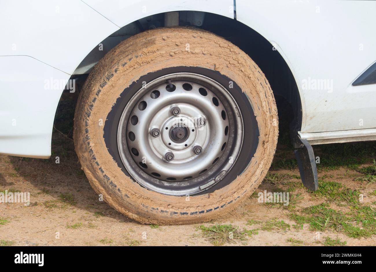 Car wheel completely covered in mud. Total loss of tire grip Stock ...