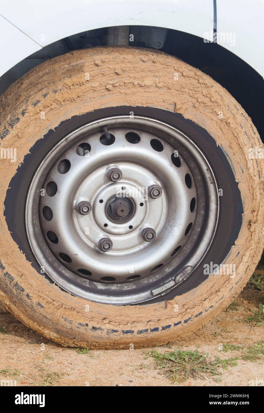 Car wheel completely covered in mud. Total loss of tire grip Stock ...