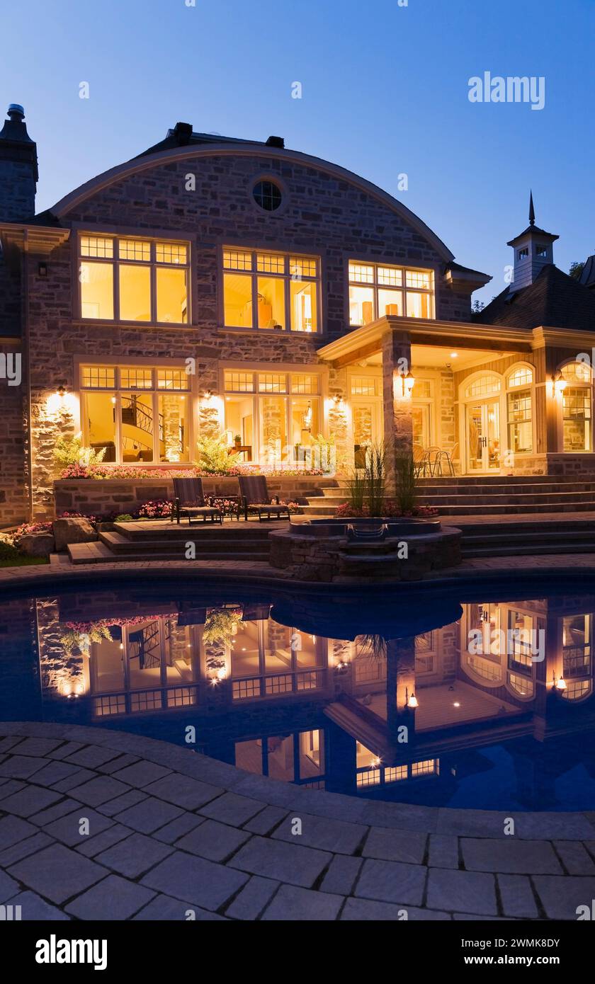 In-ground swimming pool in backyard of luxurious two story natural ...