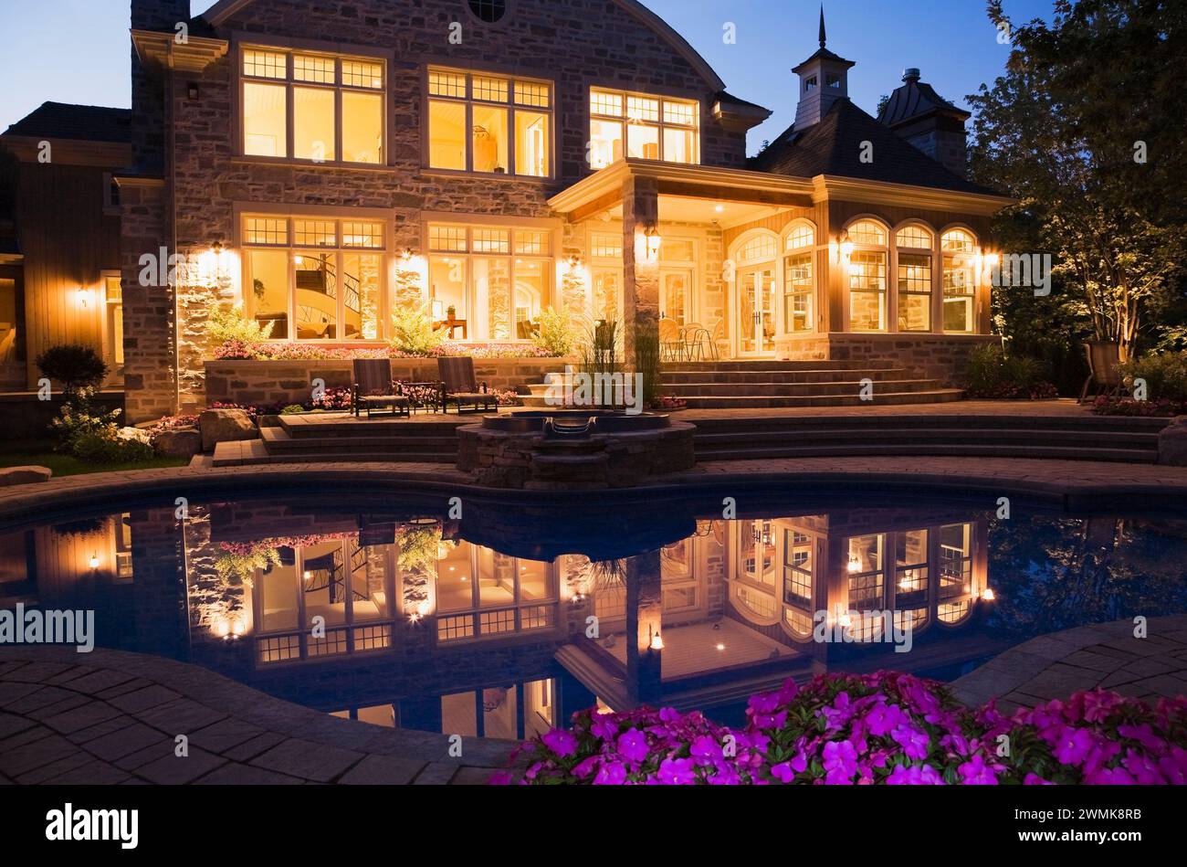 In-ground swimming pool in backyard of luxurious two story natural ...