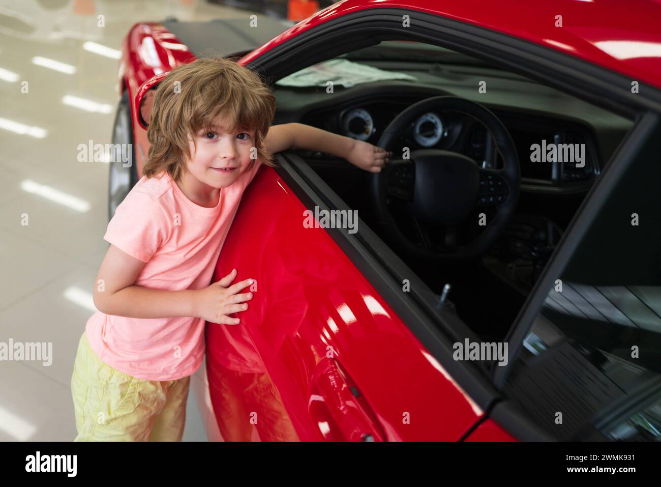 Kid Driver. Cute little boy pretending to drive. Kid in car with his ...