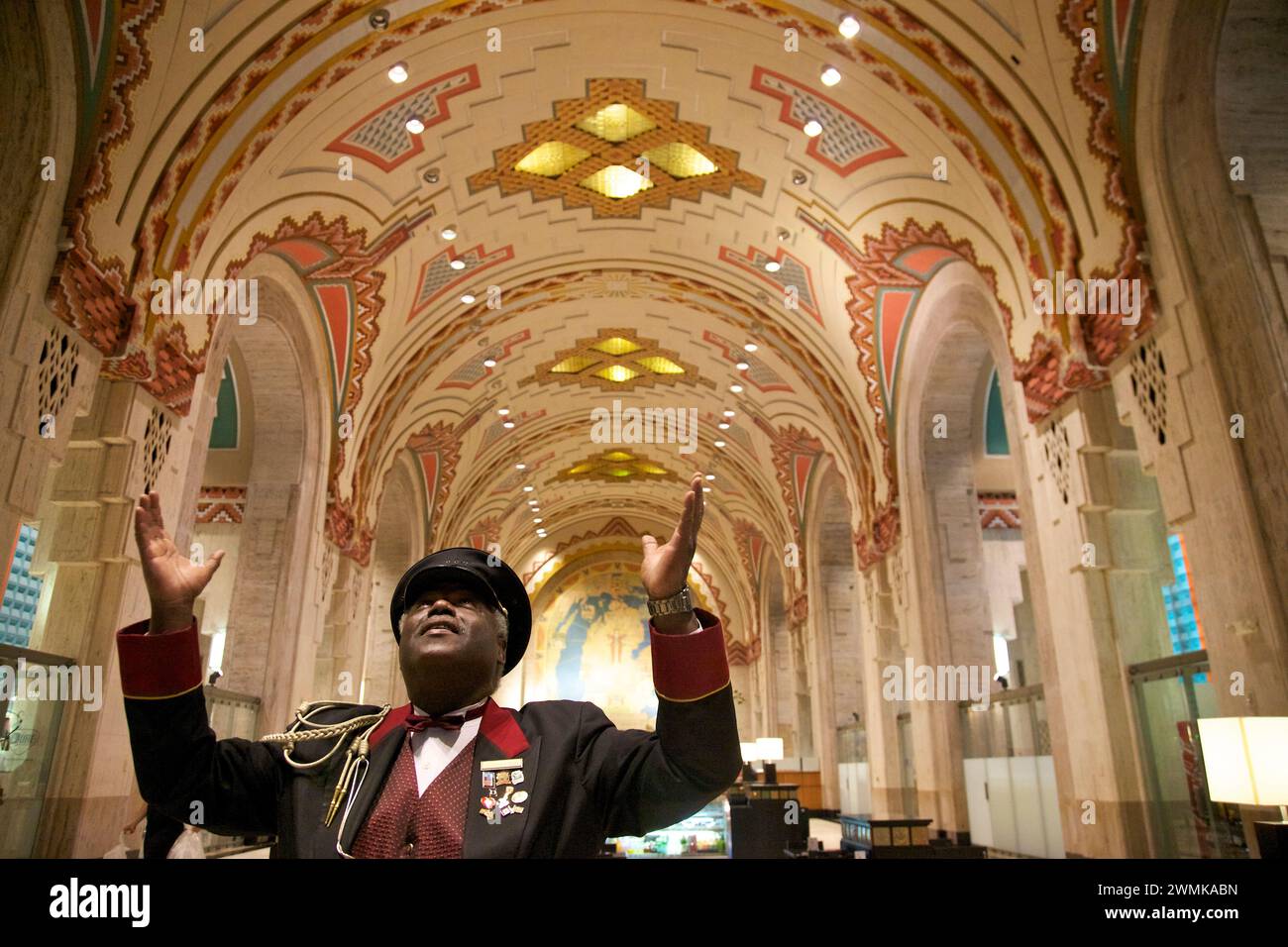 Building doorman admires a vaulted Art Deco ceiling; Detroit, Michigan ...