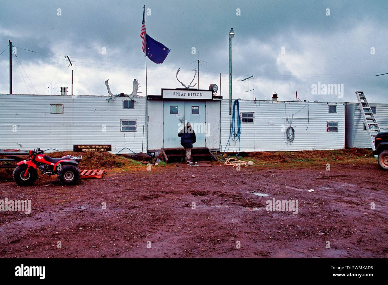 Worker enters the front door of the Umiat Hilton, in the unincorporated ...