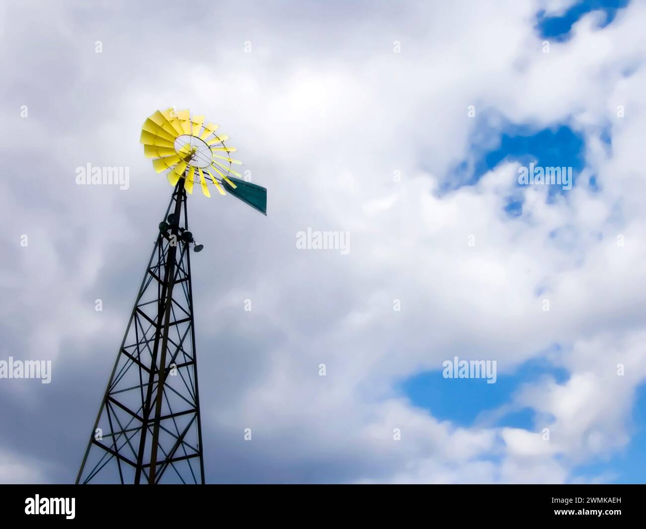 Blades of a windmill are painted yellow to mimic a flower; United ...