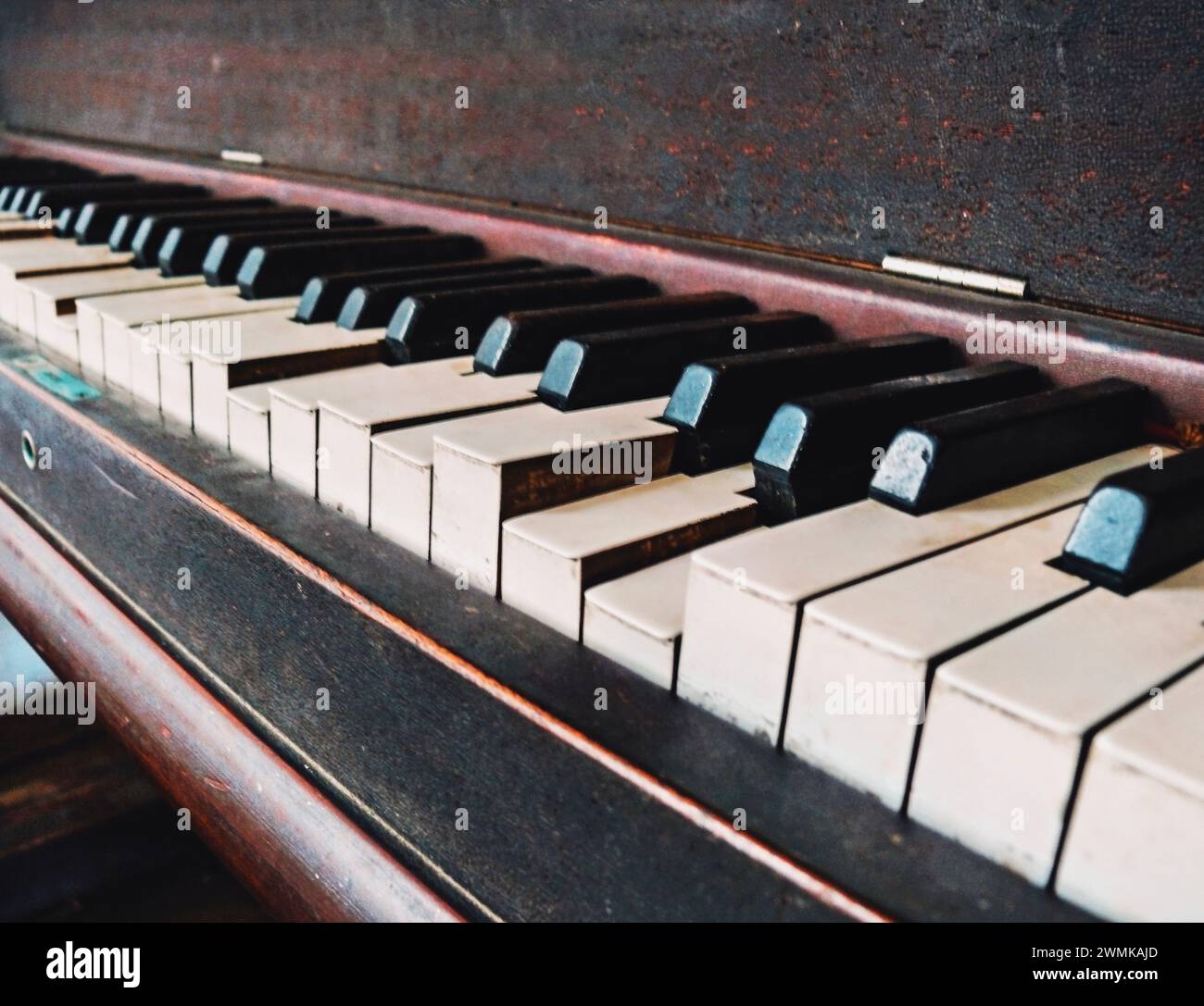 Keys on an old piano show their age as their action has deteriorated ...