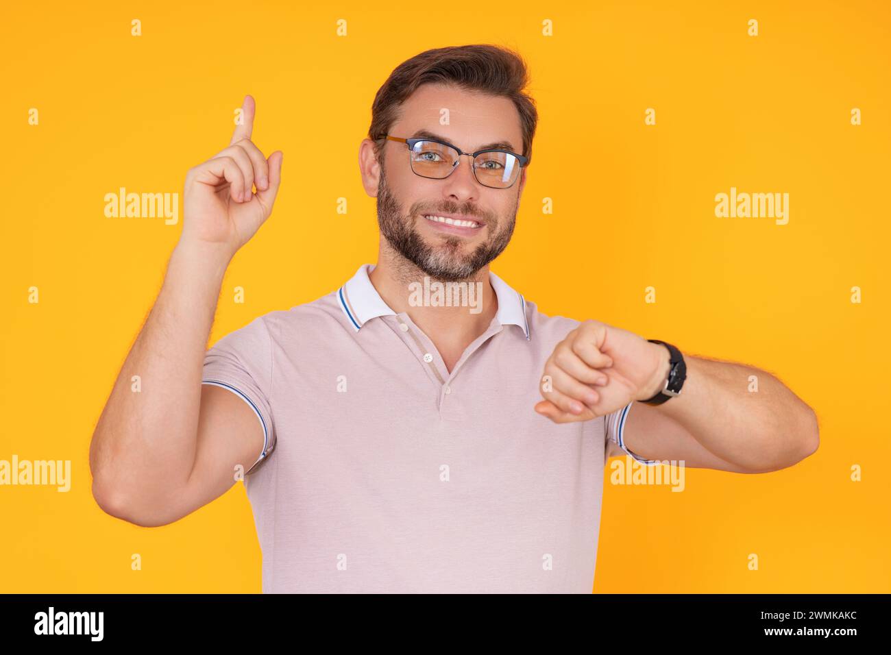 Excited man In hurry pointing to watch time, impatience, deadline. Guy ...