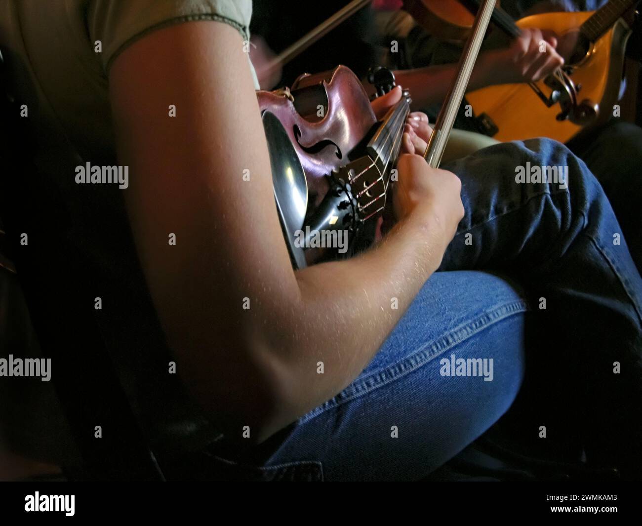 Girl sitting legs arms crossed hi-res stock photography and images - Alamy