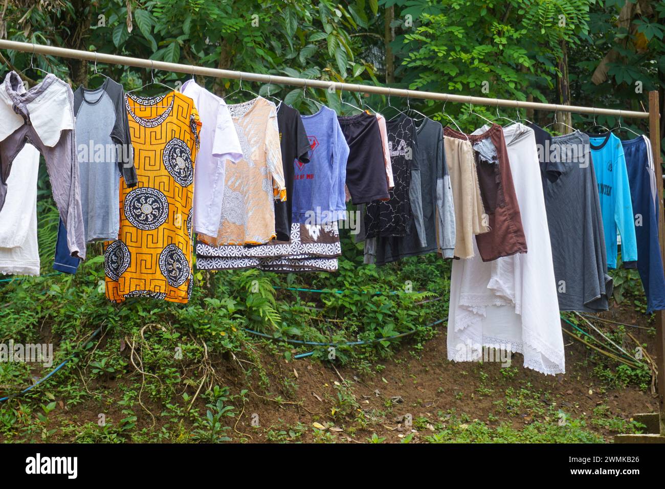 Drying clothes that have been washed manually using the sun Stock Photo ...