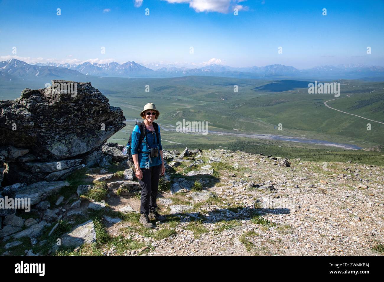 Portrait of a mature woman hiker on the Savage Alpine Trail with views ...