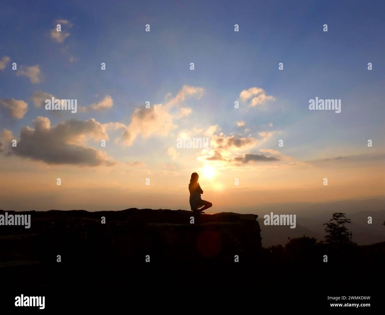 Girl looks on in wonder at the Blue Ridge Mountains at sunset; North ...