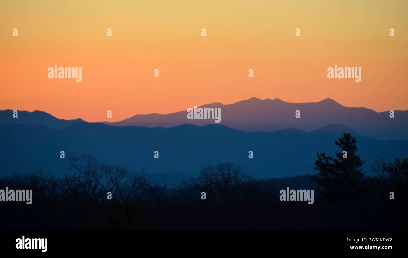 Orange sky sunset over the silhouetted ridge of the Great Smoky ...