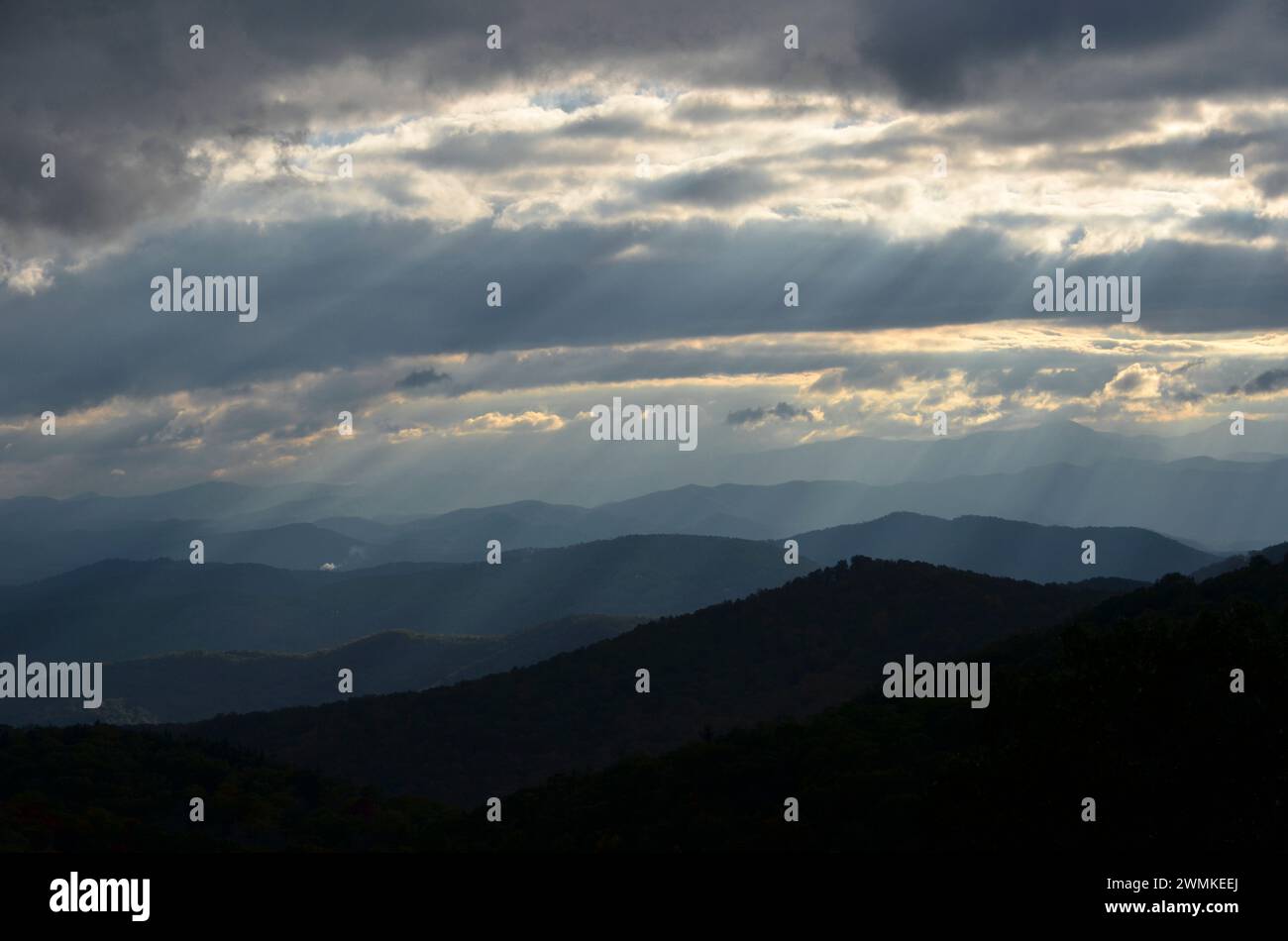 Beams of sunlight break through storm clouds in the Blue Ridge ...