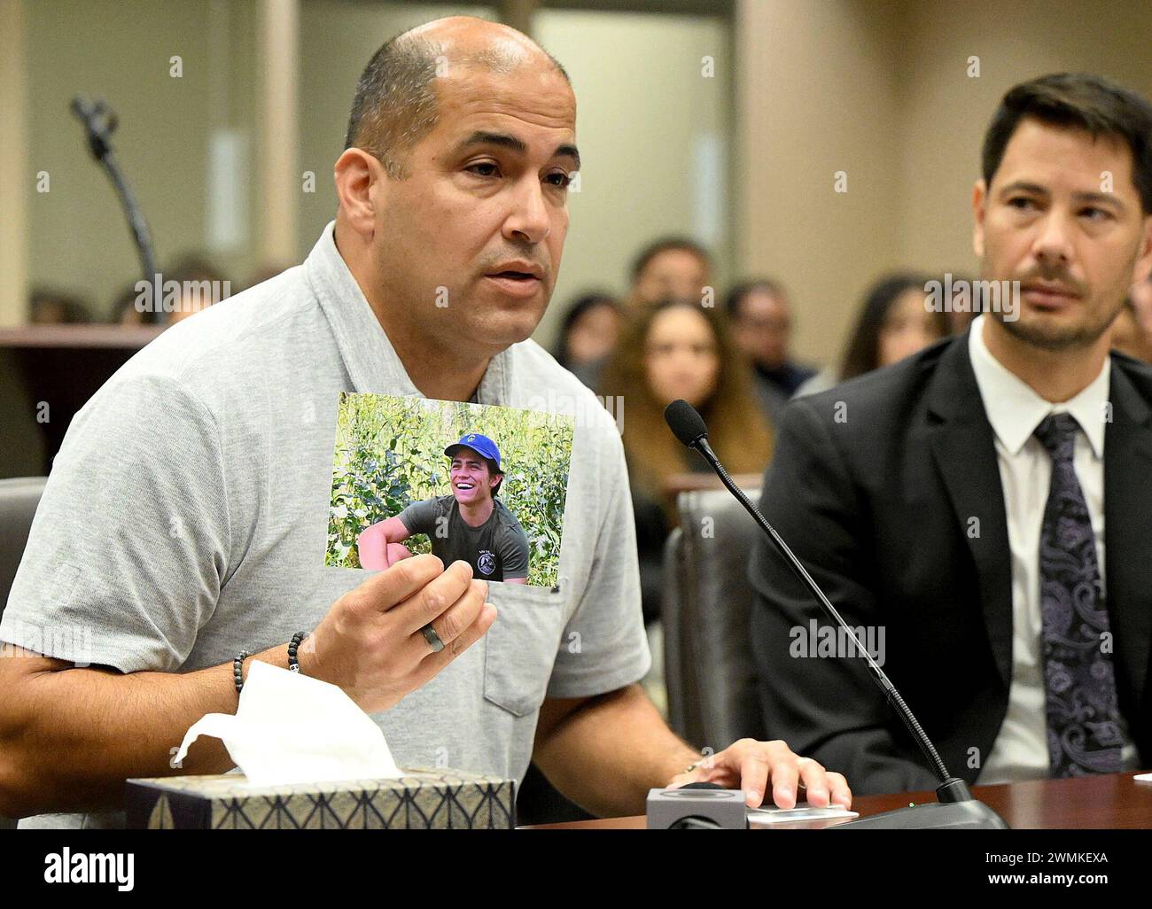 Brian Barajas, left, father of murdered teen Anthony Barajas, holds up ...