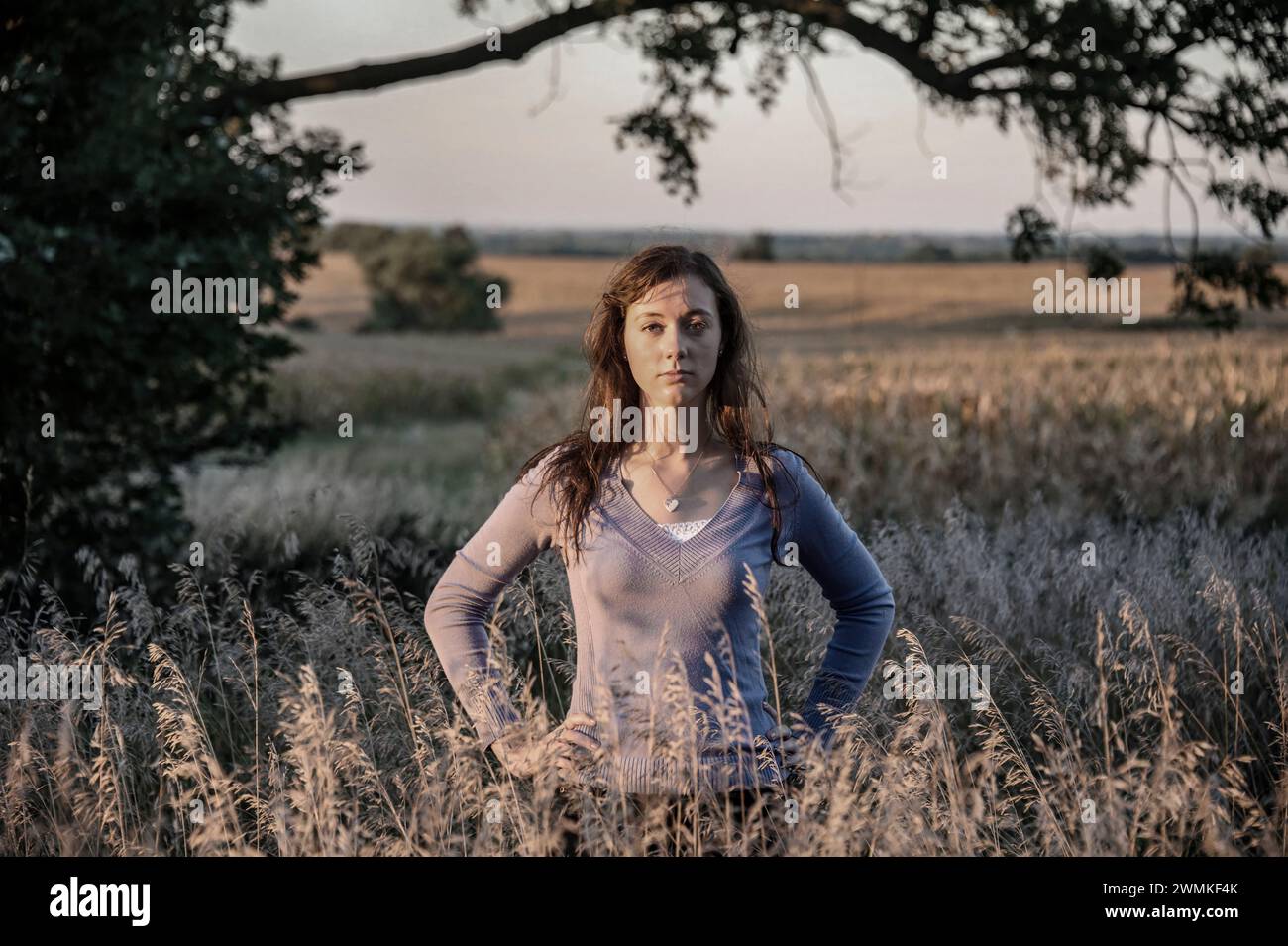 Portrait of a teenage girl in a country field; Dunbar, Nebraska, United ...