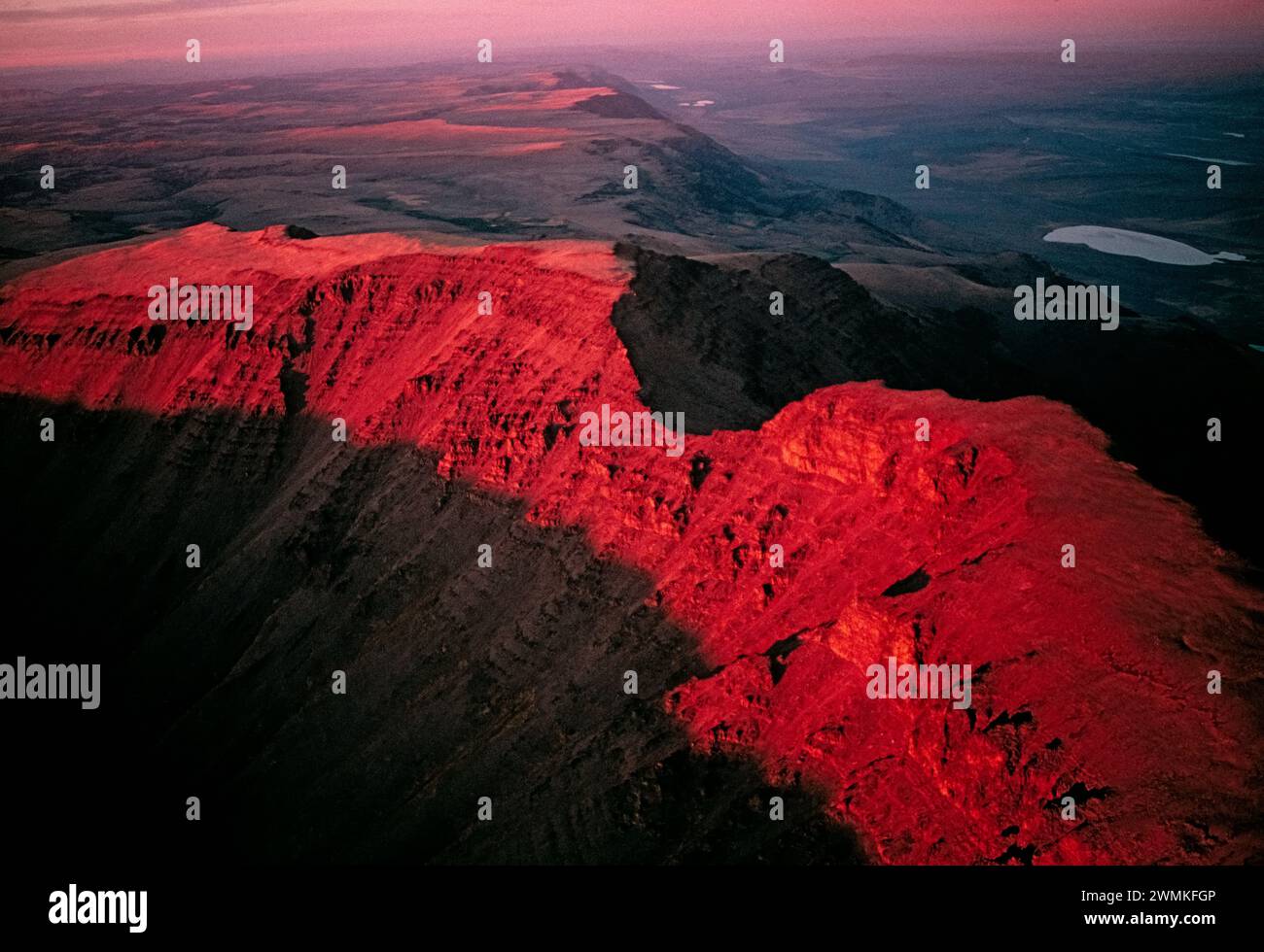 Blazing sunset leaves in shadow the famous gap in Kiger Gorge, atop ...