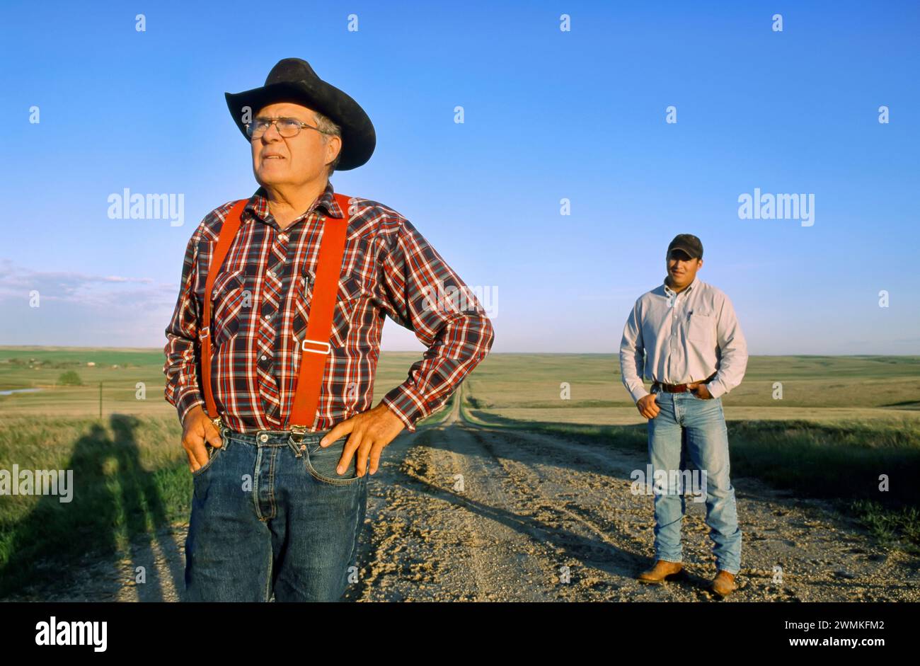 Father and son together on their ranch; Howes, South Dakota, United ...