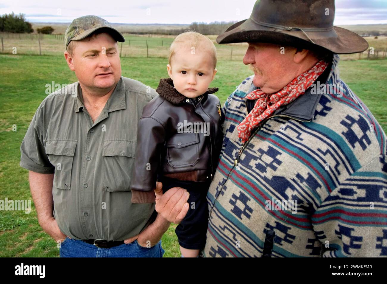 Three generations, a father, son and grandson spending time together on ...