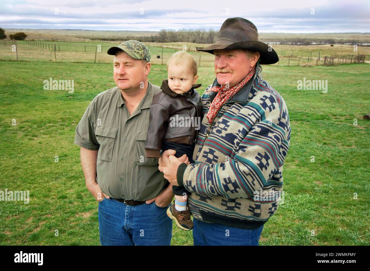 Three generations, a father, son and grandson spending time together on ...