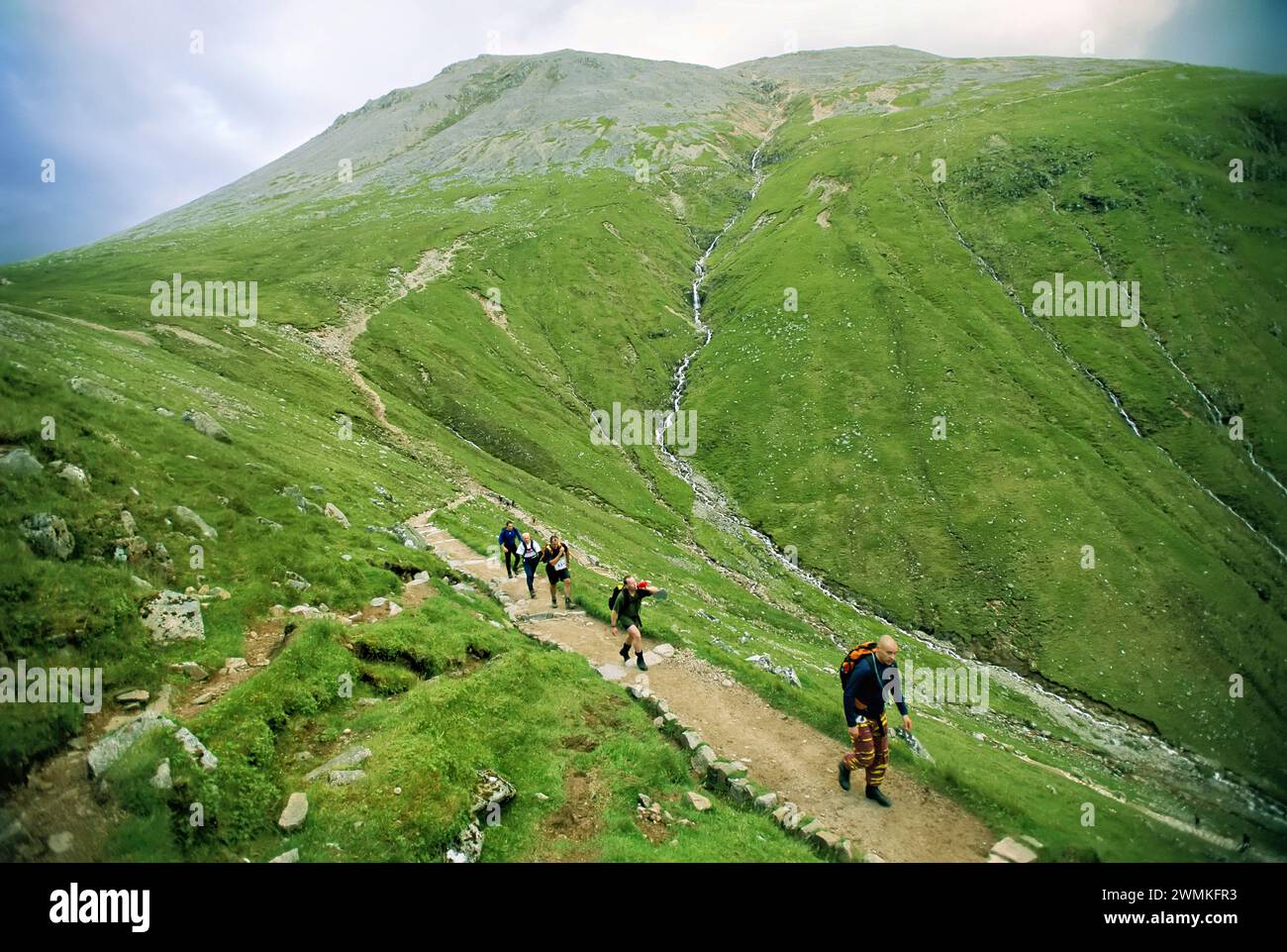 Team of hikers climb Scotland's Ben Nevis peak; Ben Nevis, Scotland ...