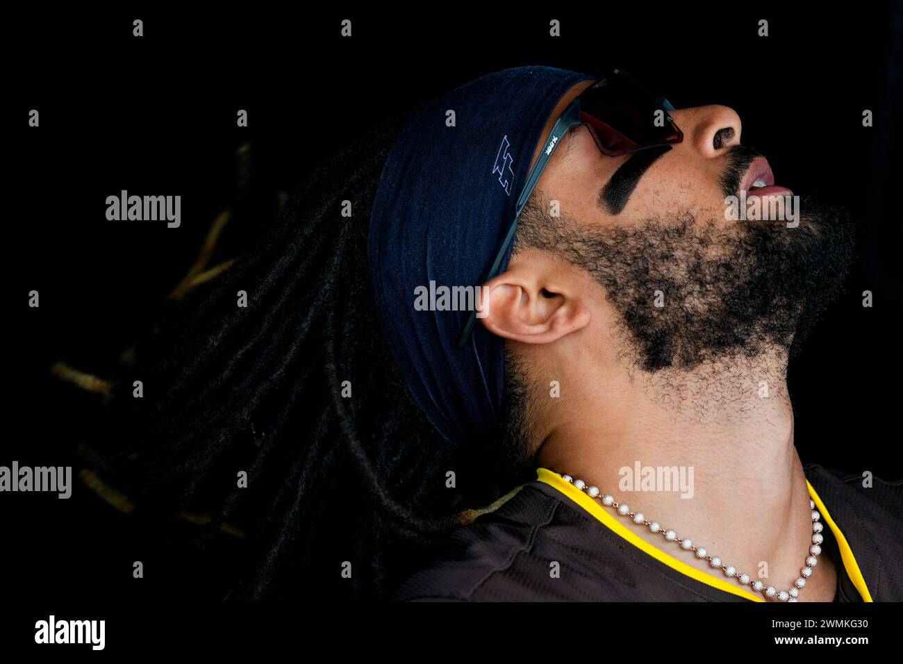 San Diego Padres' Fernando Tatis Jr. adjusts his hair before putting on ...