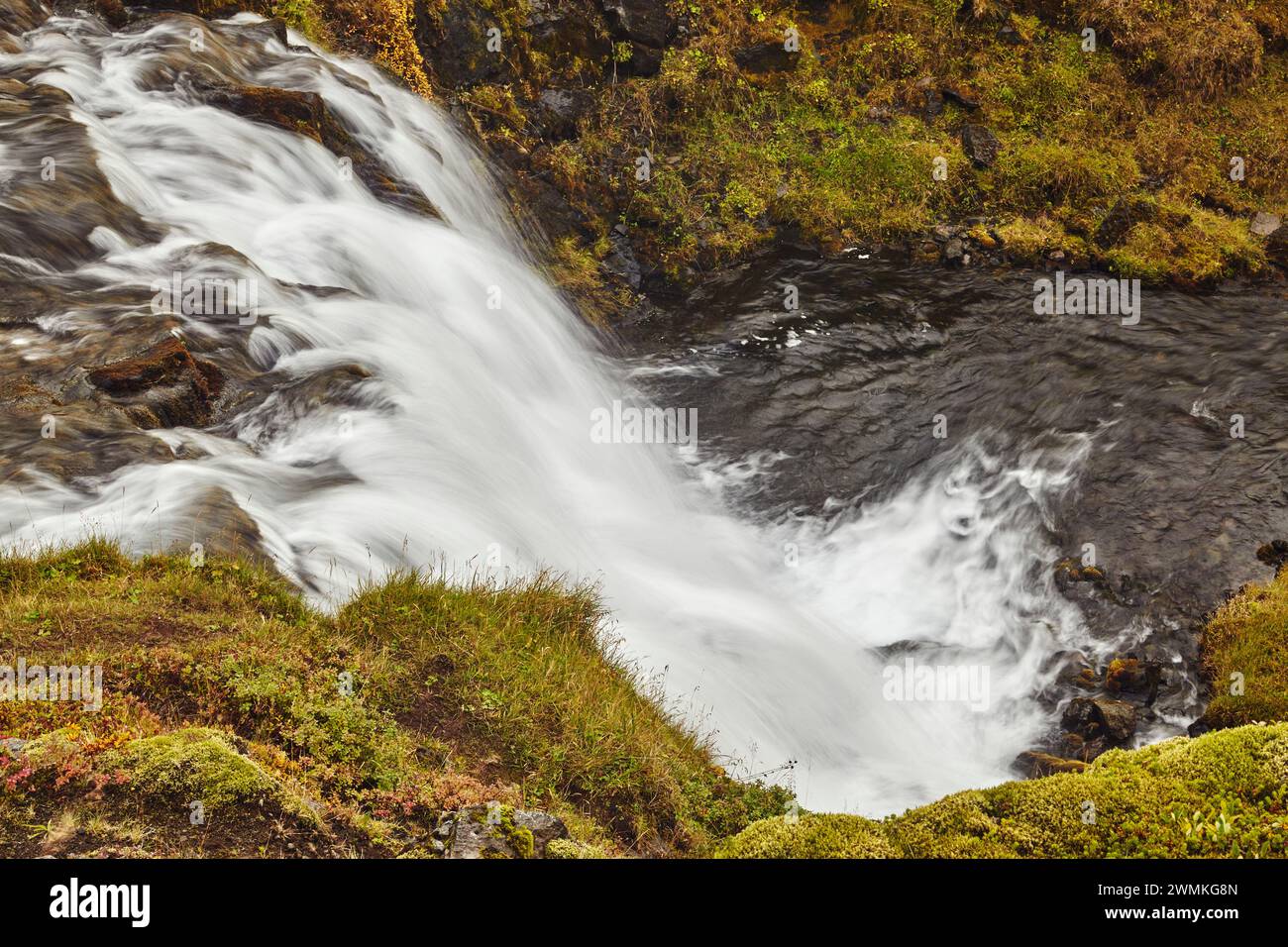 Moss covered rock and the rugged beauty of Hafrafell waterfall in ...
