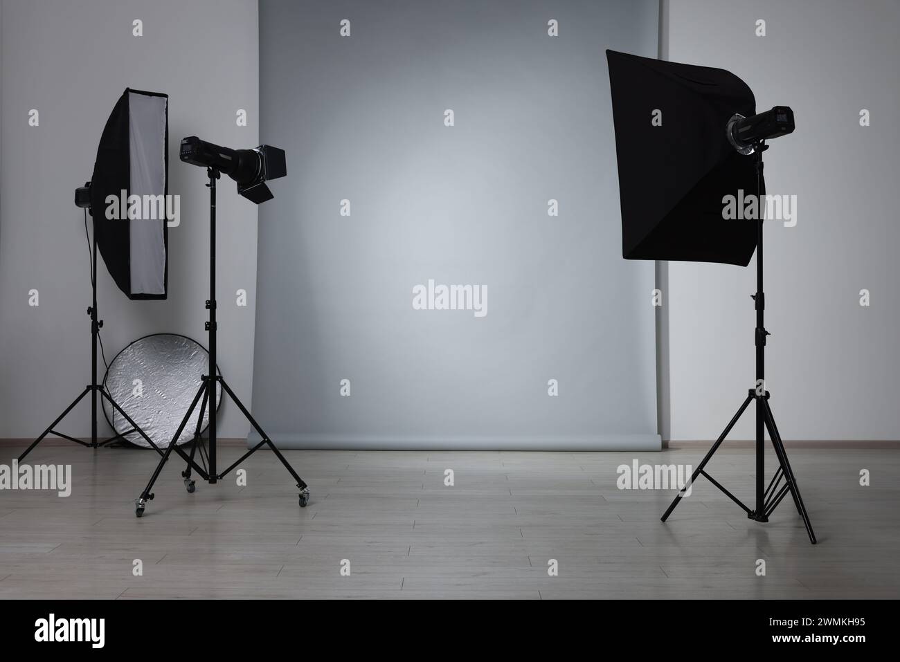 Modern light grey photo background and professional lighting equipment ...