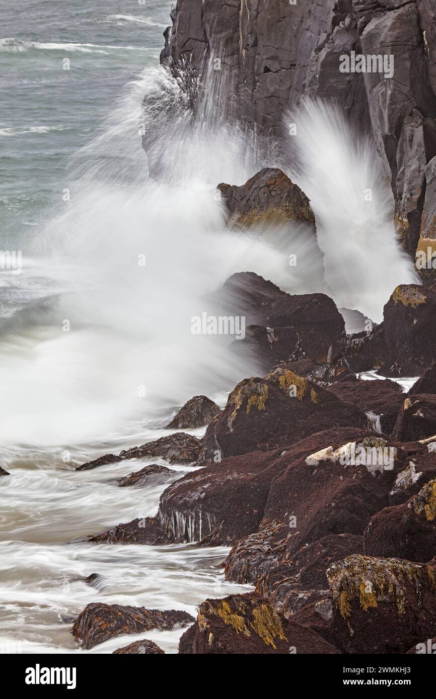 Surf sprays on the cliffs at Skardsvik, Snaefellsnes peninsula, west ...