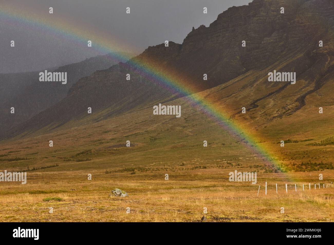 Rainbow stretches across a valley on the Snaefellsnes peninsula, on the ...