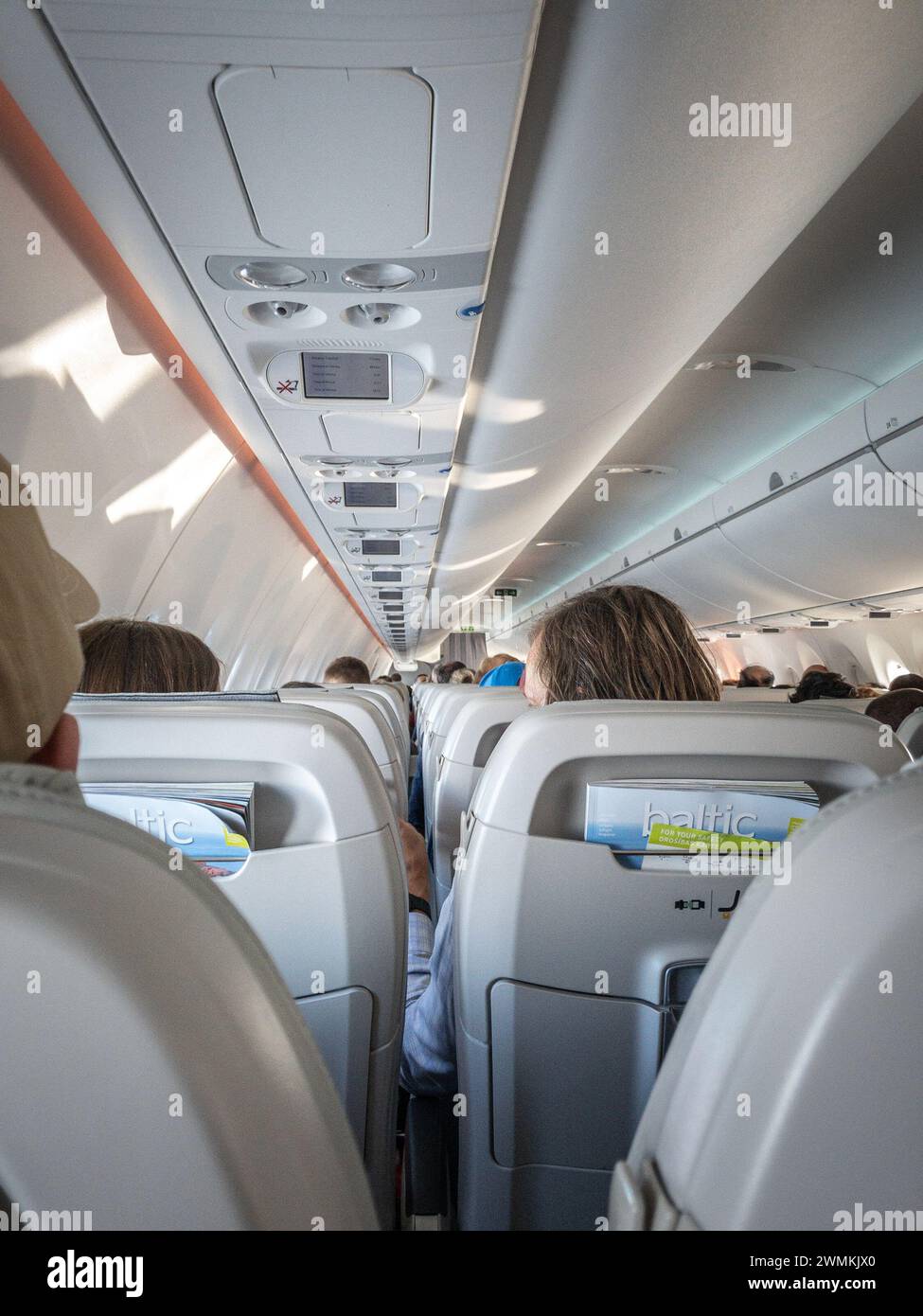 Picture of the interior cabin of an Air Baltic A220 in Riga. airBaltic ...