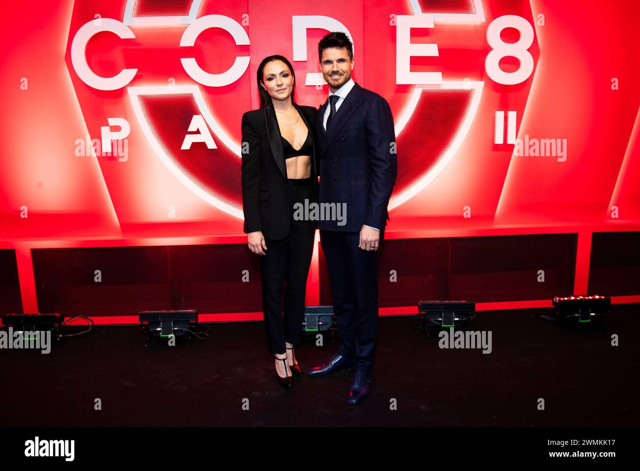 Robbie Amell, right, and wife Italia Ricci arrive at the premiere of ...