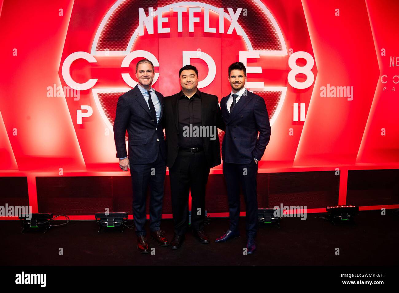 From left, Stephen Amell, director Jeff Chan and Robbie Amell arrive at ...