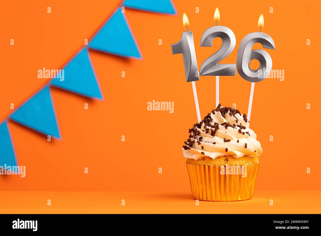 Birthday cupcake with candle number 126 - Orange background Stock Photo ...