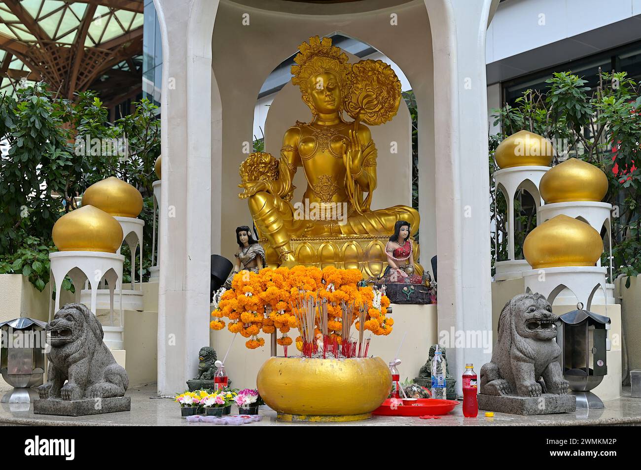 Umathevi, the Thai representation of Parvati, with lions at her side ...