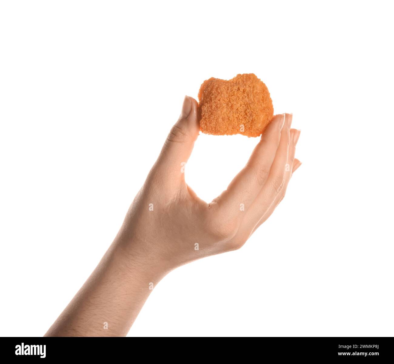 Female hand with tasty nugget on white background Stock Photo - Alamy
