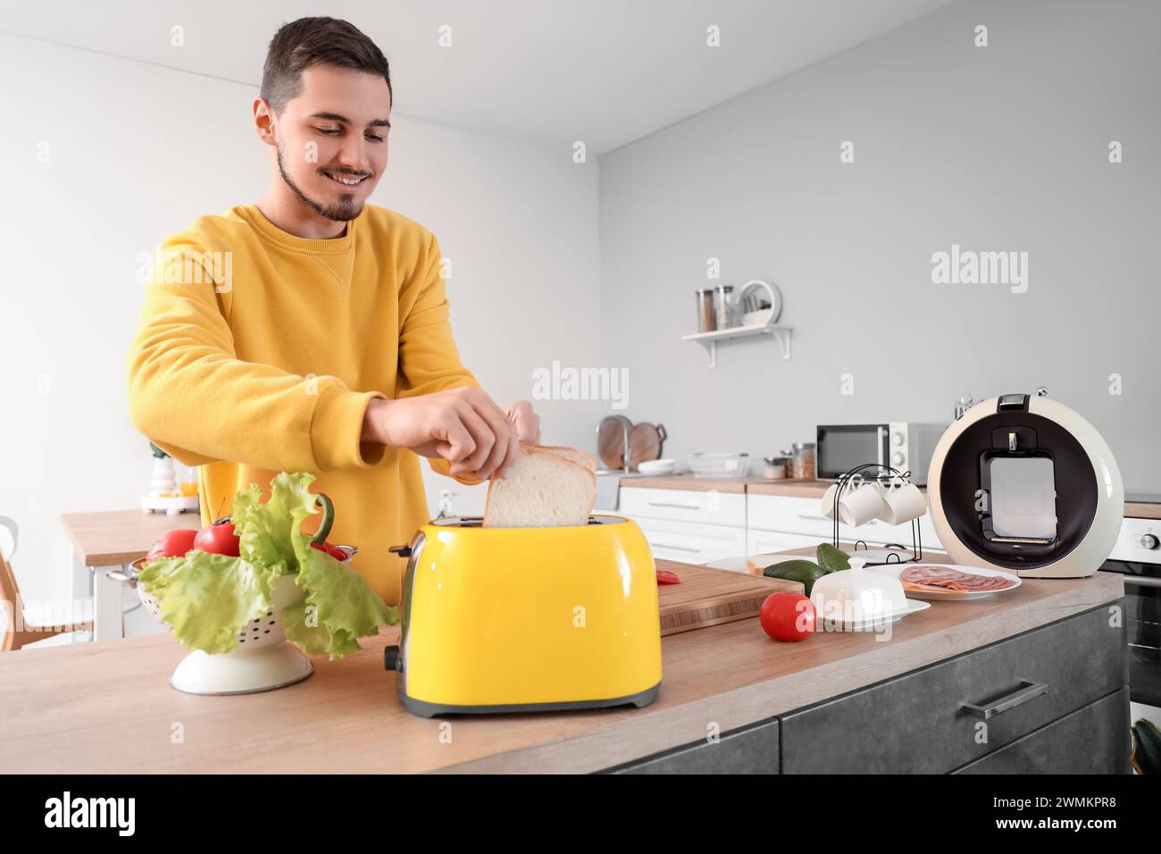 Man preparing tasty toasts hi-res stock photography and images - Alamy