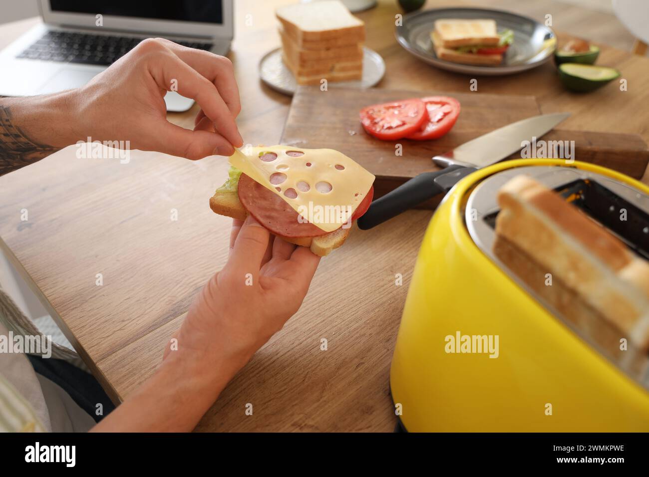 Closeup hands prepare sandwiches in hi-res stock photography and images ...