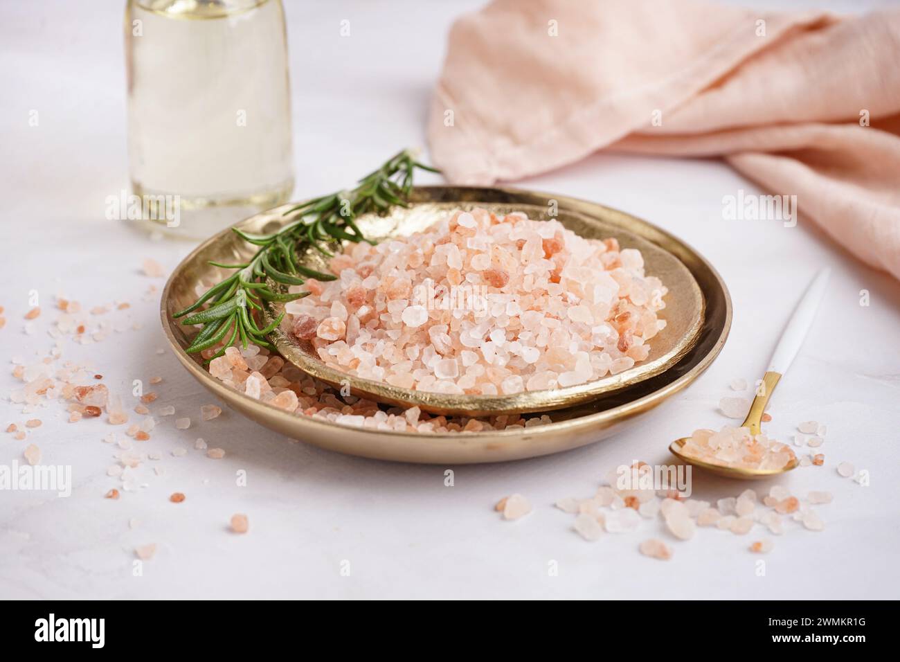 Plates with Himalayan pink salt and rosemary on white background Stock ...