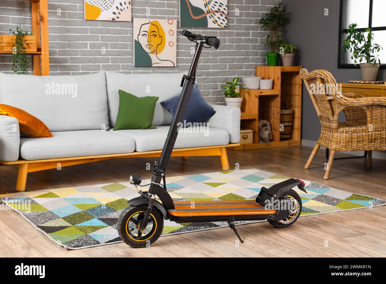 Electric scooter in interior of modern living room Stock Photo - Alamy