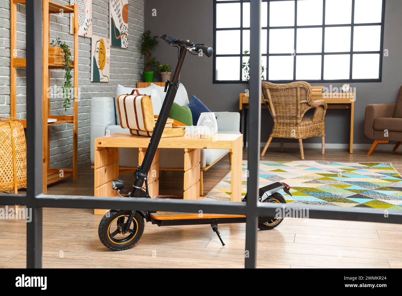 Electric scooter in interior of modern living room, view through ...