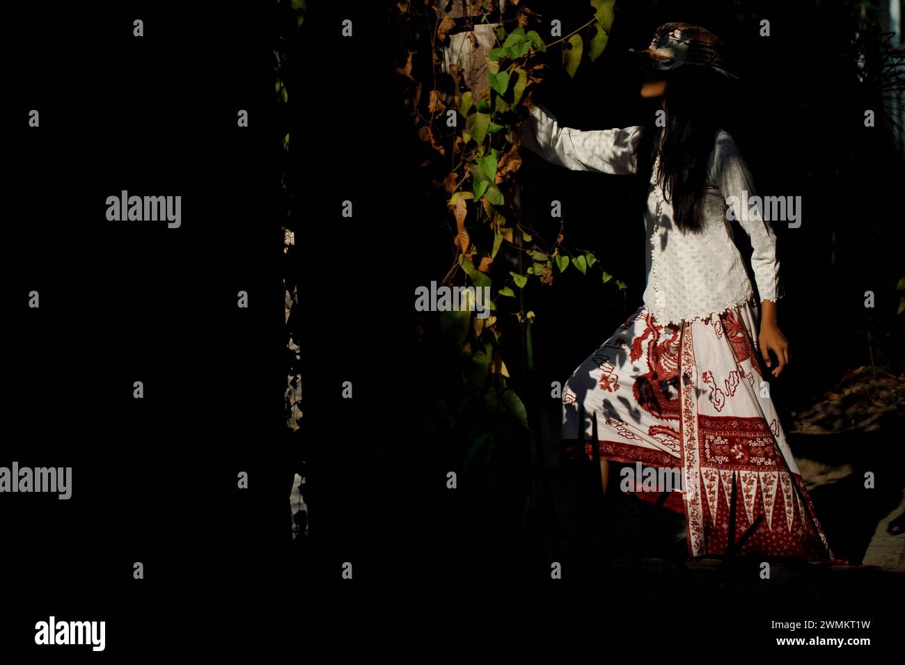 A female model presents a kebaya dress guided by Batik Jagad Phonik ...