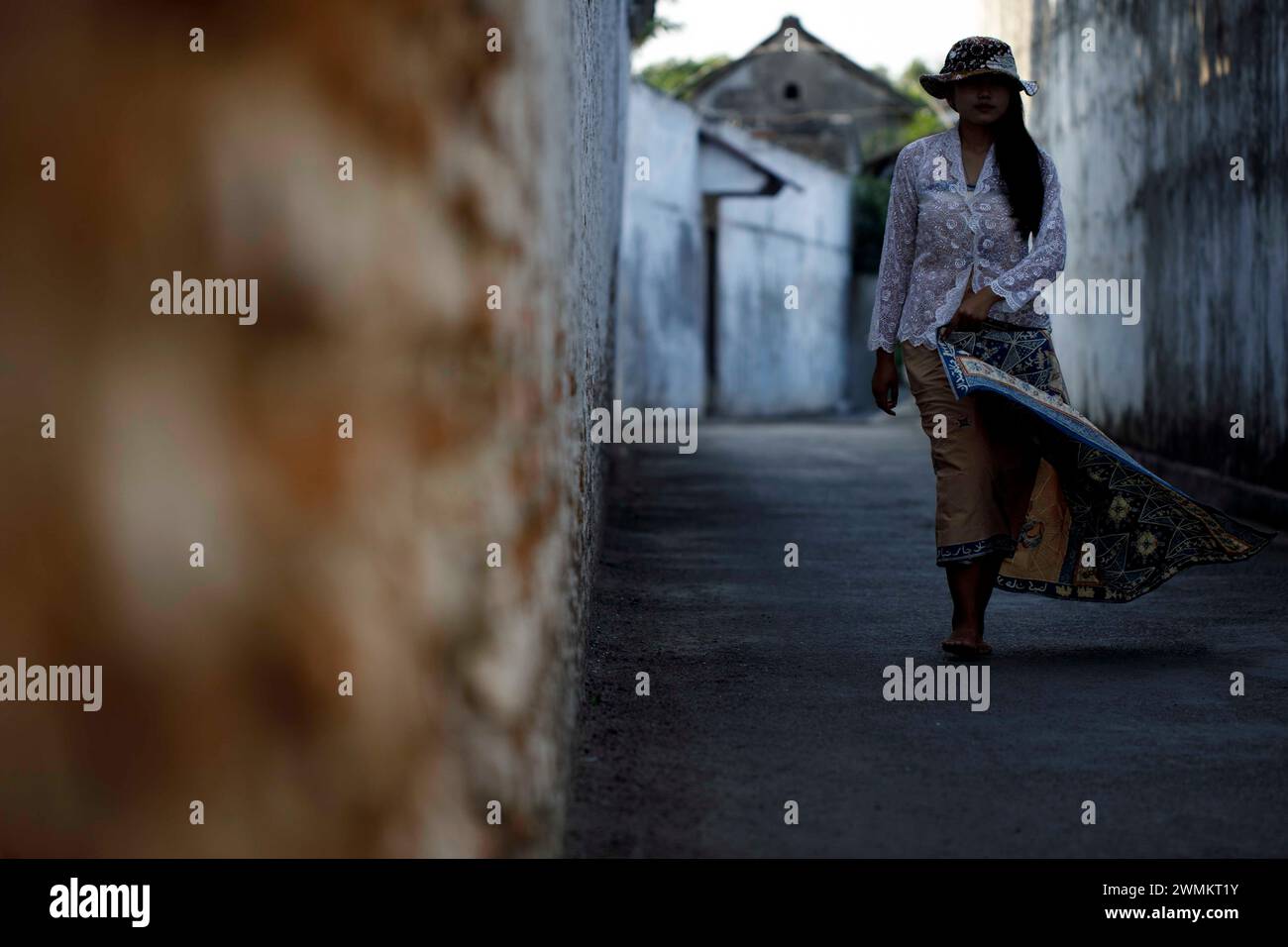 A female model presents a kebaya dress guided by Batik Jagad Phonik ...
