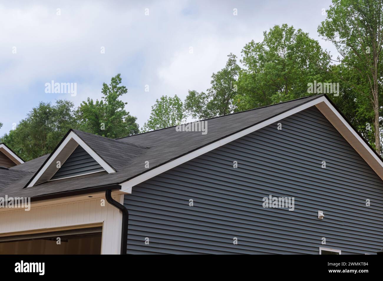 Detail rooftop overlapping roofing asphalt shingles on new build ...