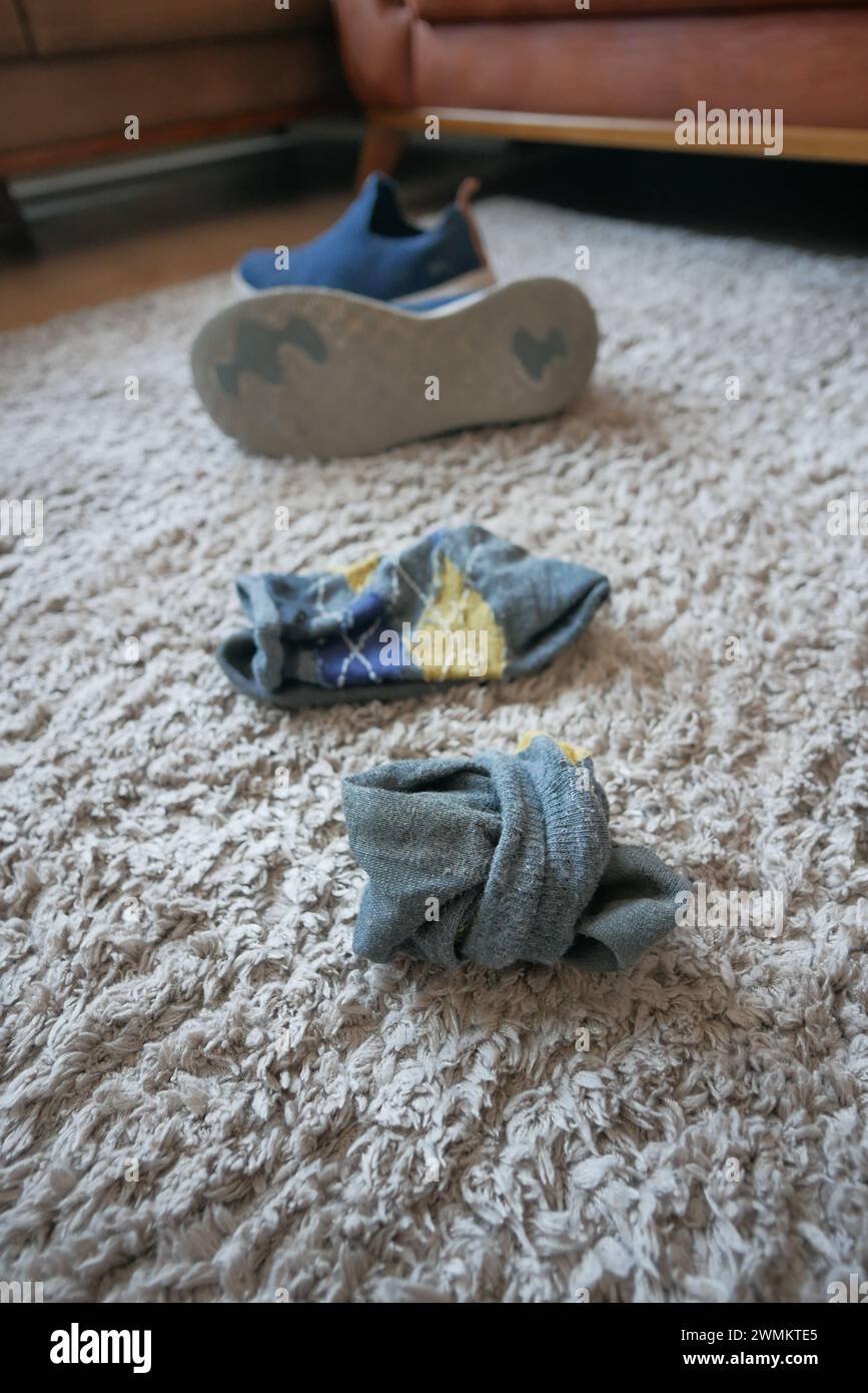 dirty sock and shoe on floor Stock Photo - Alamy