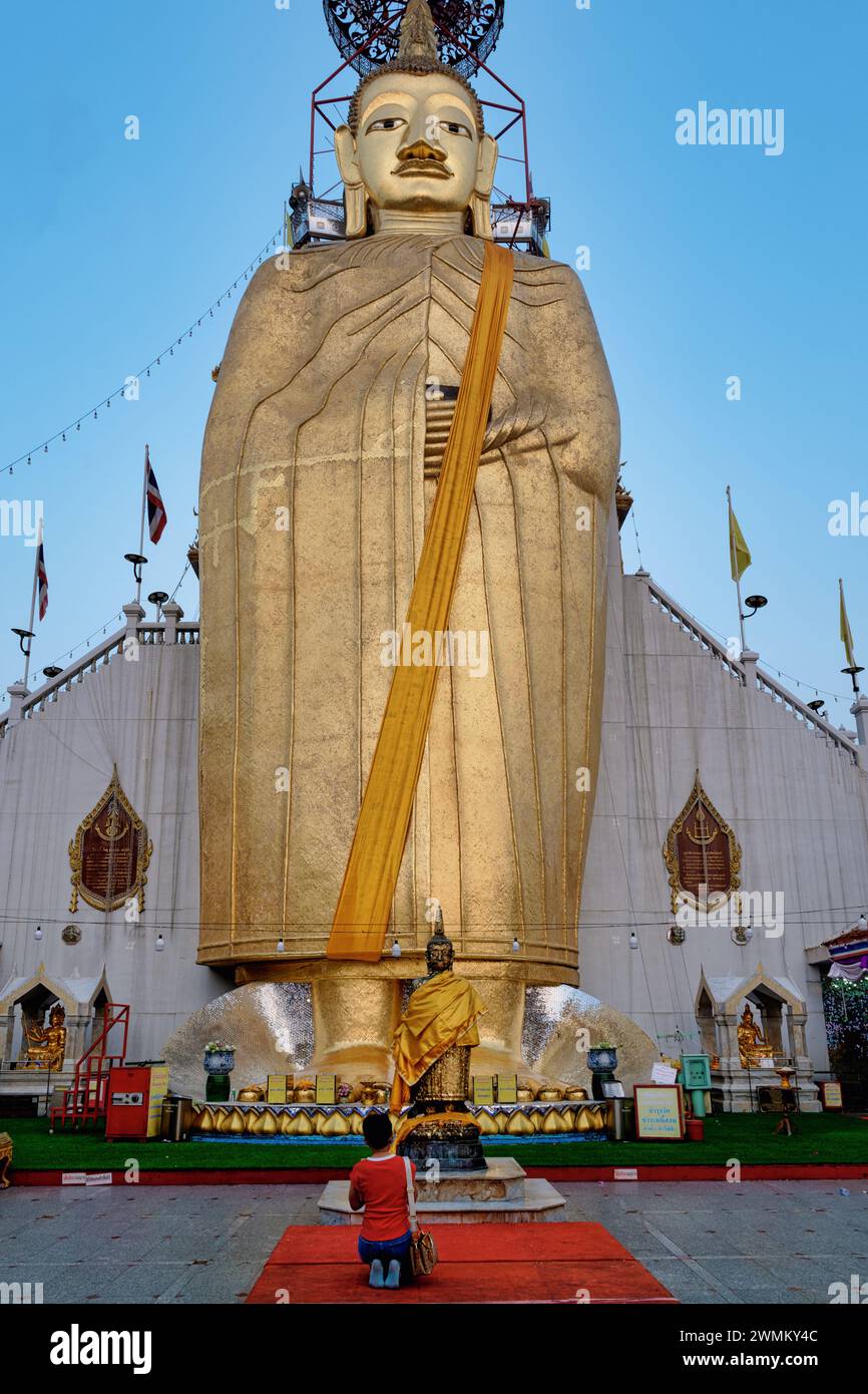 The 32 m high golden statue of a standing Buddha and a major Bangkok ...
