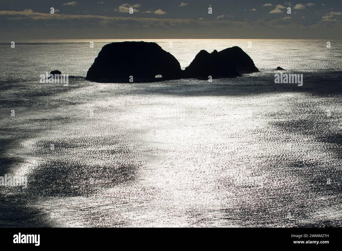 Three Arch Rocks silhouette, Cape Meares State Park, Oregon Stock Photo ...