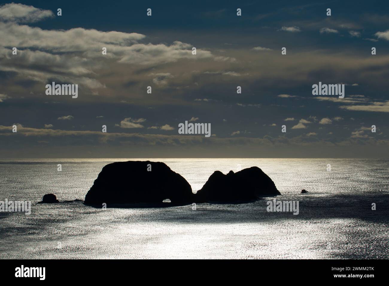 Three Arch Rocks silhouette, Cape Meares State Park, Oregon Stock Photo ...