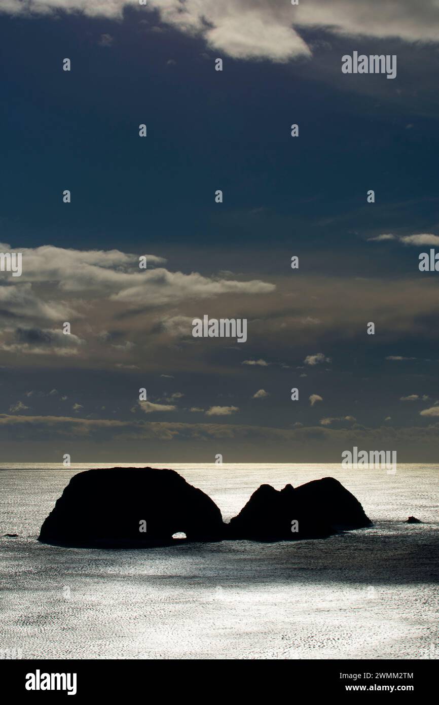 Three Arch Rocks silhouette, Cape Meares State Park, Oregon Stock Photo ...